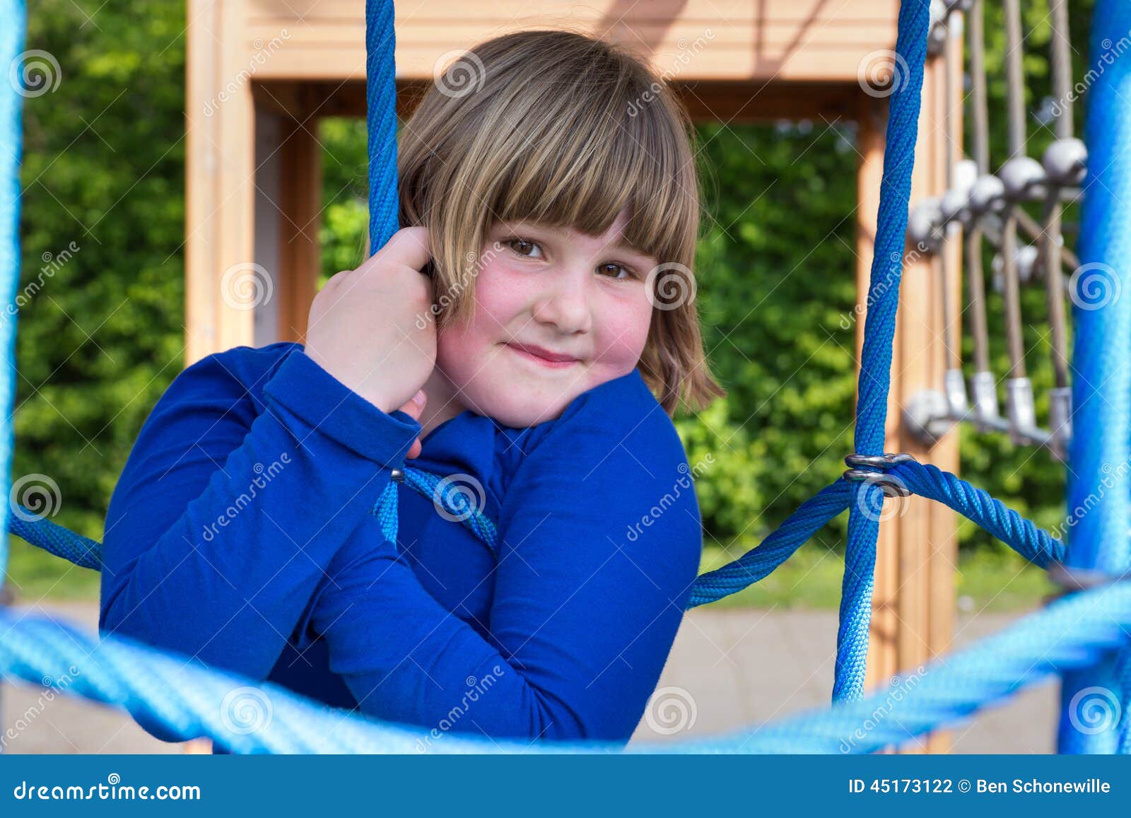 Young Girl Hanging in Web of Blue Ropes Stock Photo - Image of playful ...