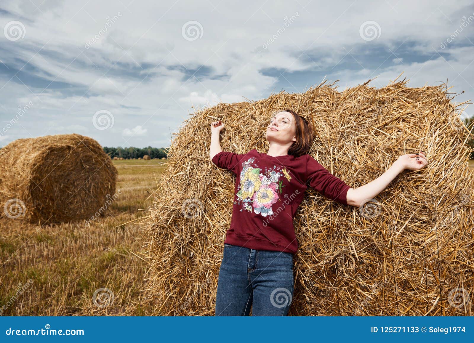 Young Girl Having Fun in the Field, Lying on a Haystack Stock Image ...