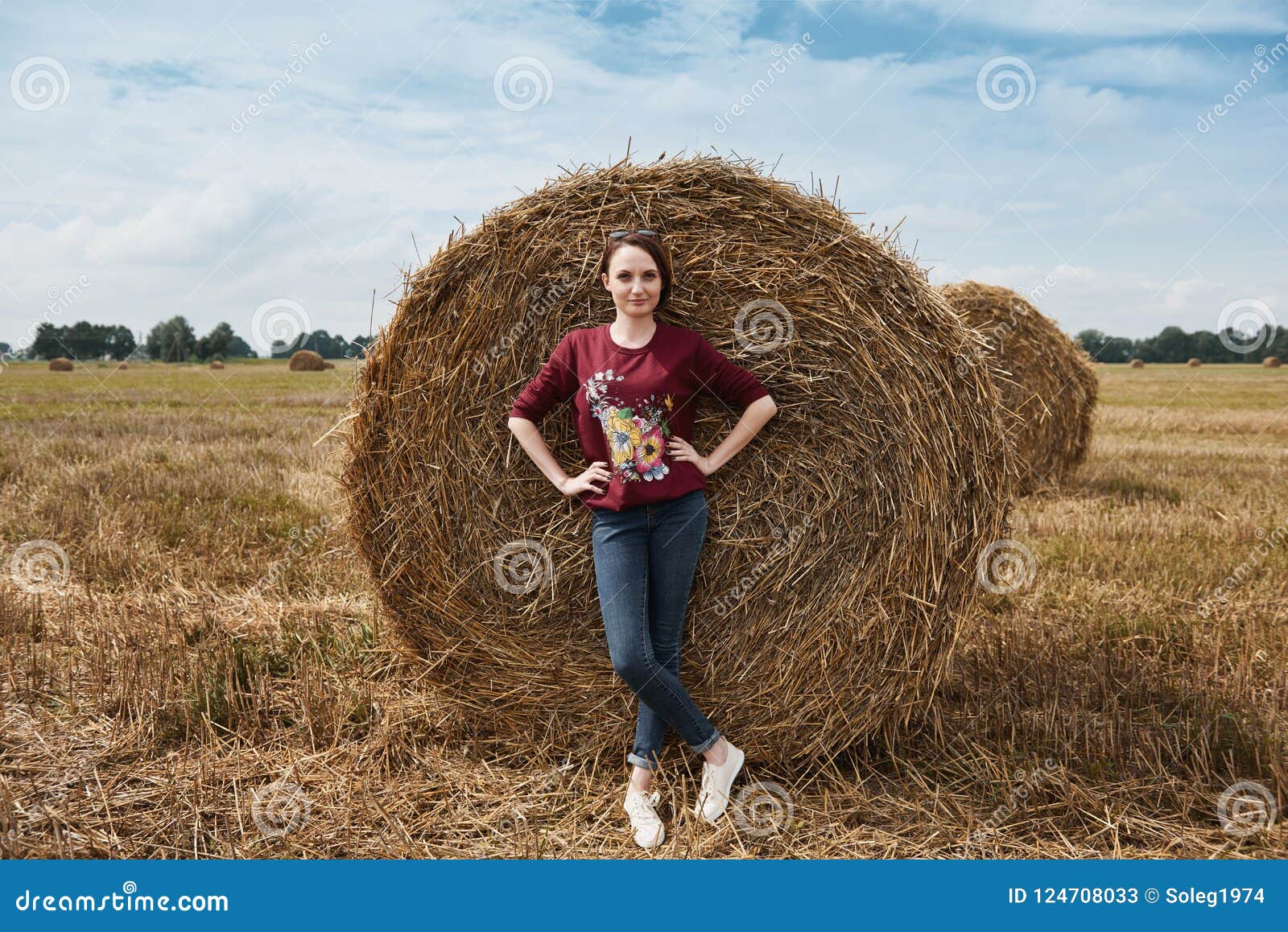 Young Girl Having Fun in the Field, Mowed Hay Wrapped in a Haystack ...