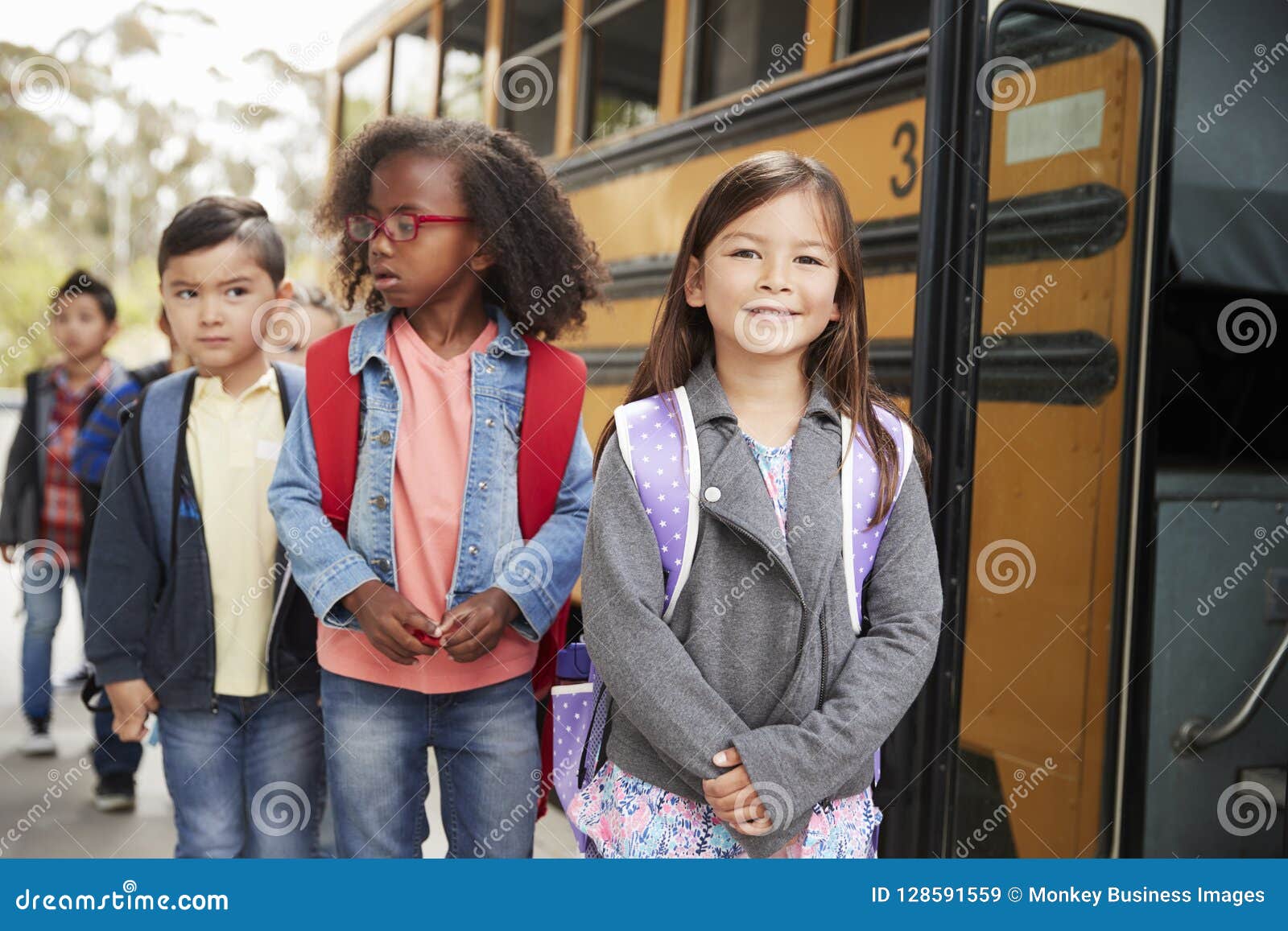 Young Girl at the Head of the Queue for the School Bus Stock Image ...