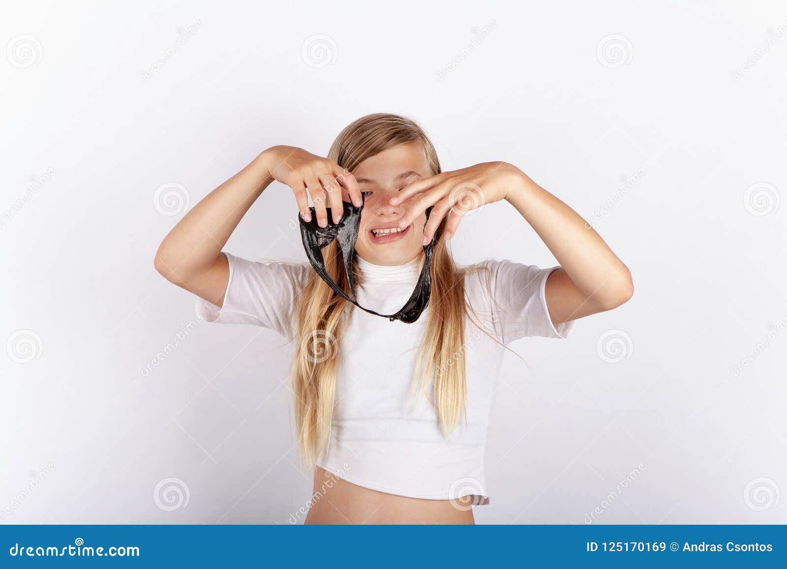 Young Girl Holding Black Slime in Front of Her Face Stock Image - Image ...