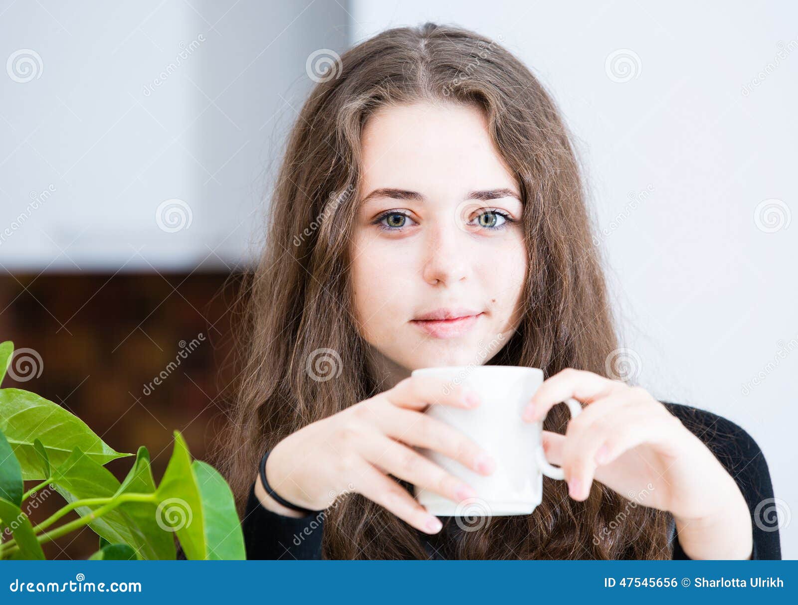 The Young Girl is Holding a Cup Stock Photo - Image of beauty, kitchen ...