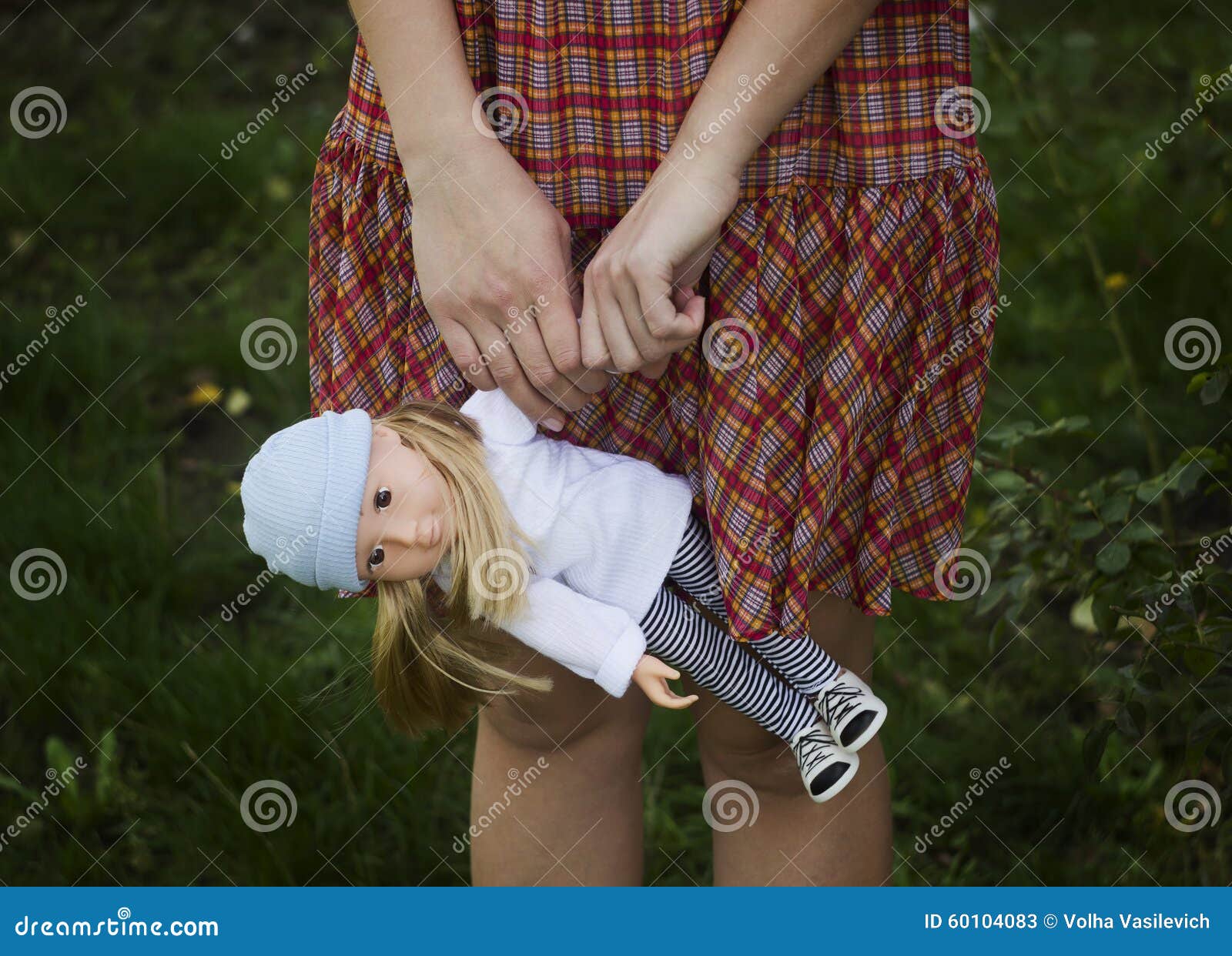 Young girl holding a doll. stock image. Image of doll - 60104083 Young girl holding a doll. stock image. Image of doll - 60104083