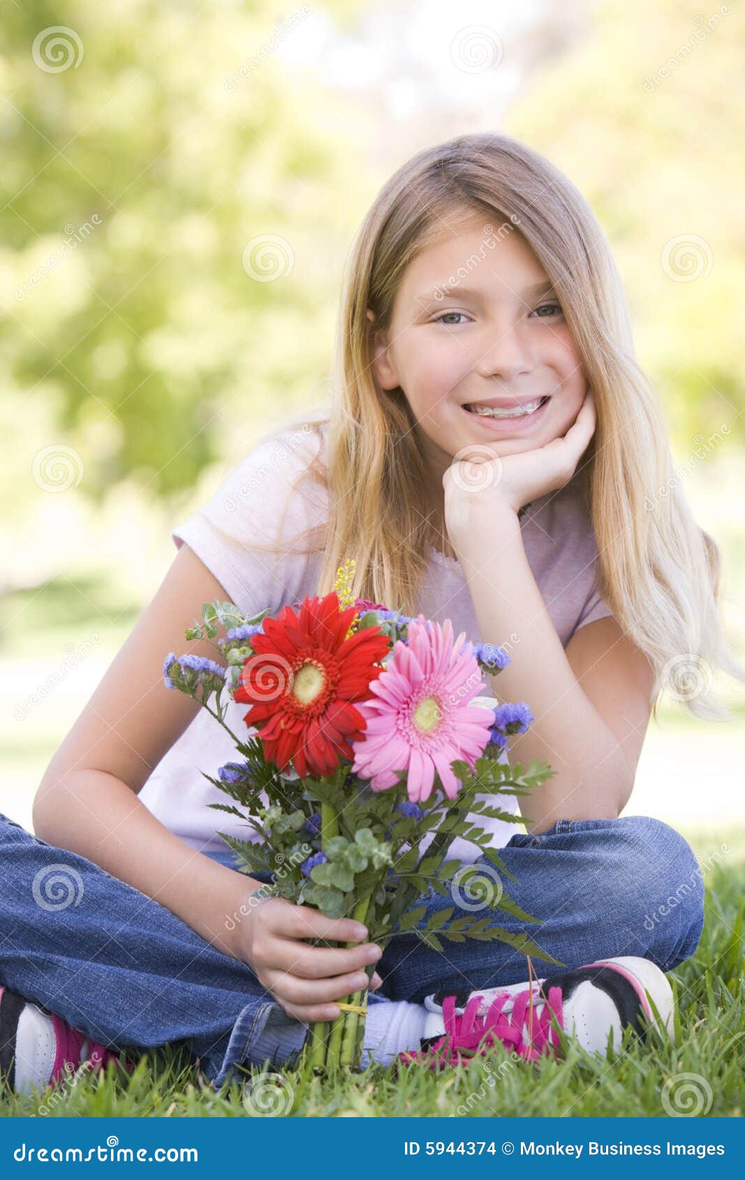 Young girl holding flowers stock photo. Image of holding - 5944374