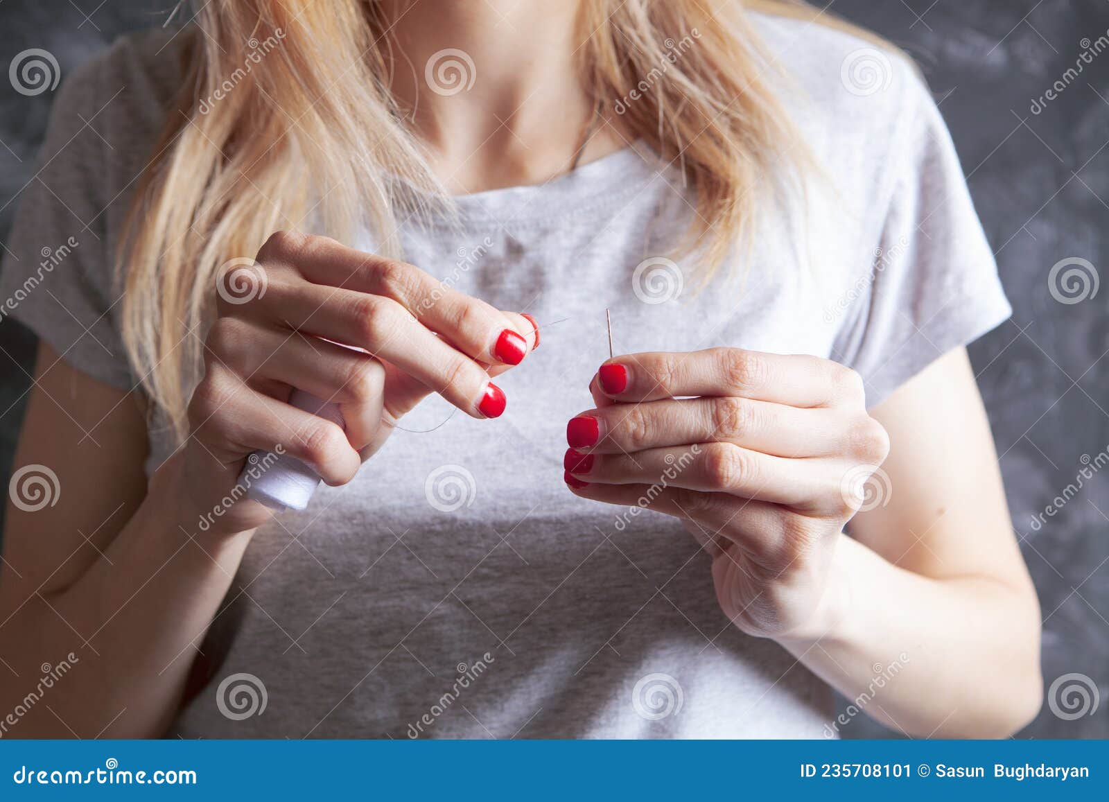 Young Girl Holding a Thread and a Needle Stock Image - Image of holding ...