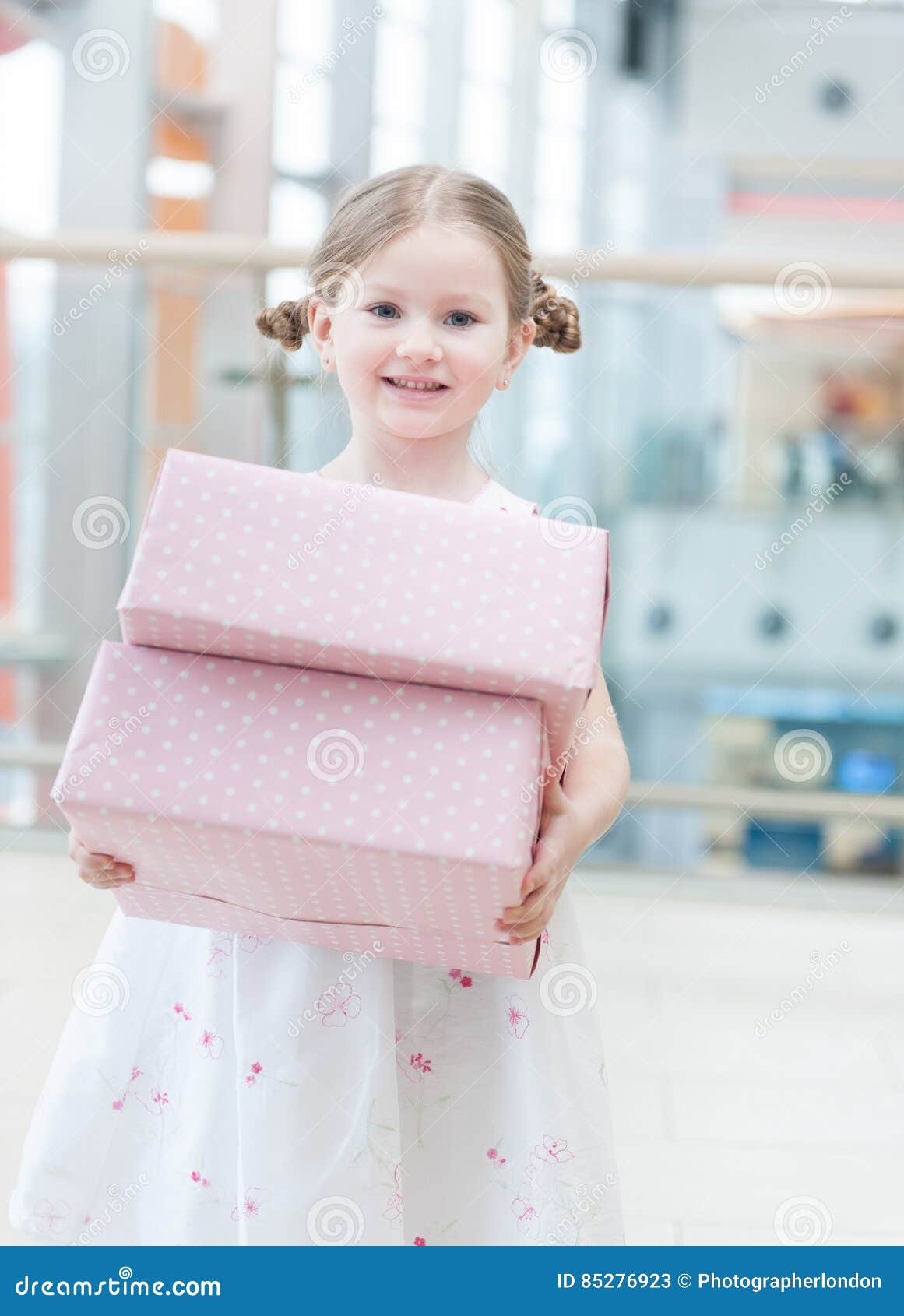 Young Girl Holding Two Gift Wrapped Boxes Stock Image - Image of female ...