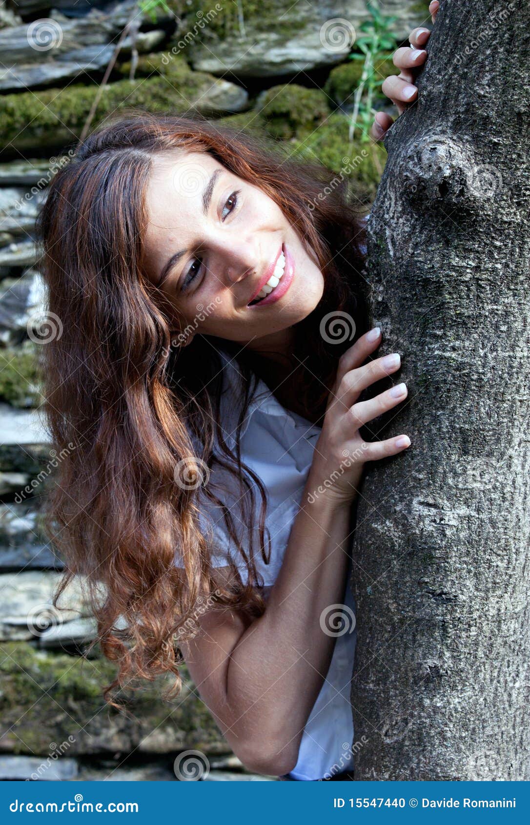 Young girl hugging a tree stock photo. Image of cute - 15547440