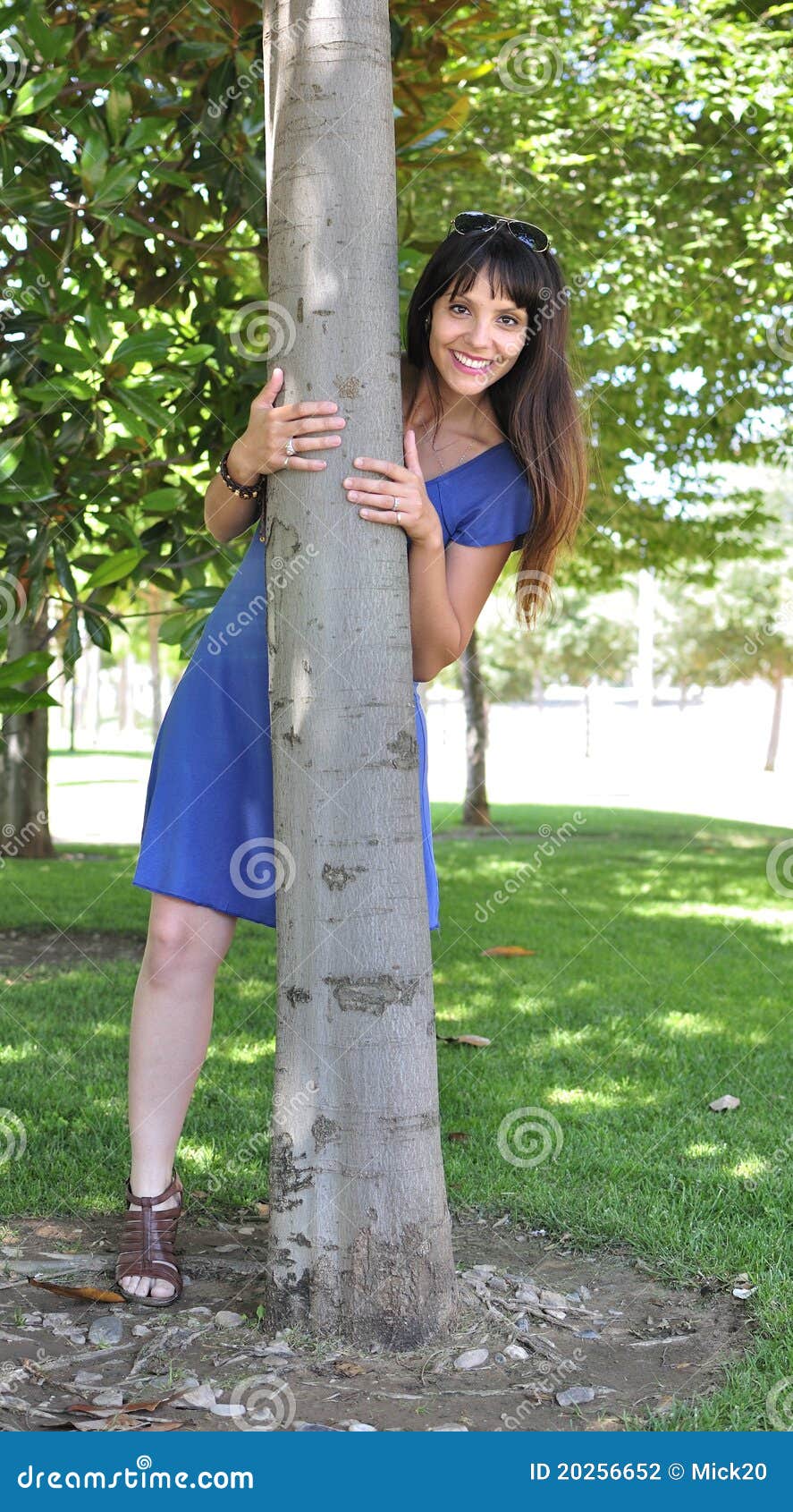 Young girl hugging a tree stock photo. Image of beautiful - 20256652