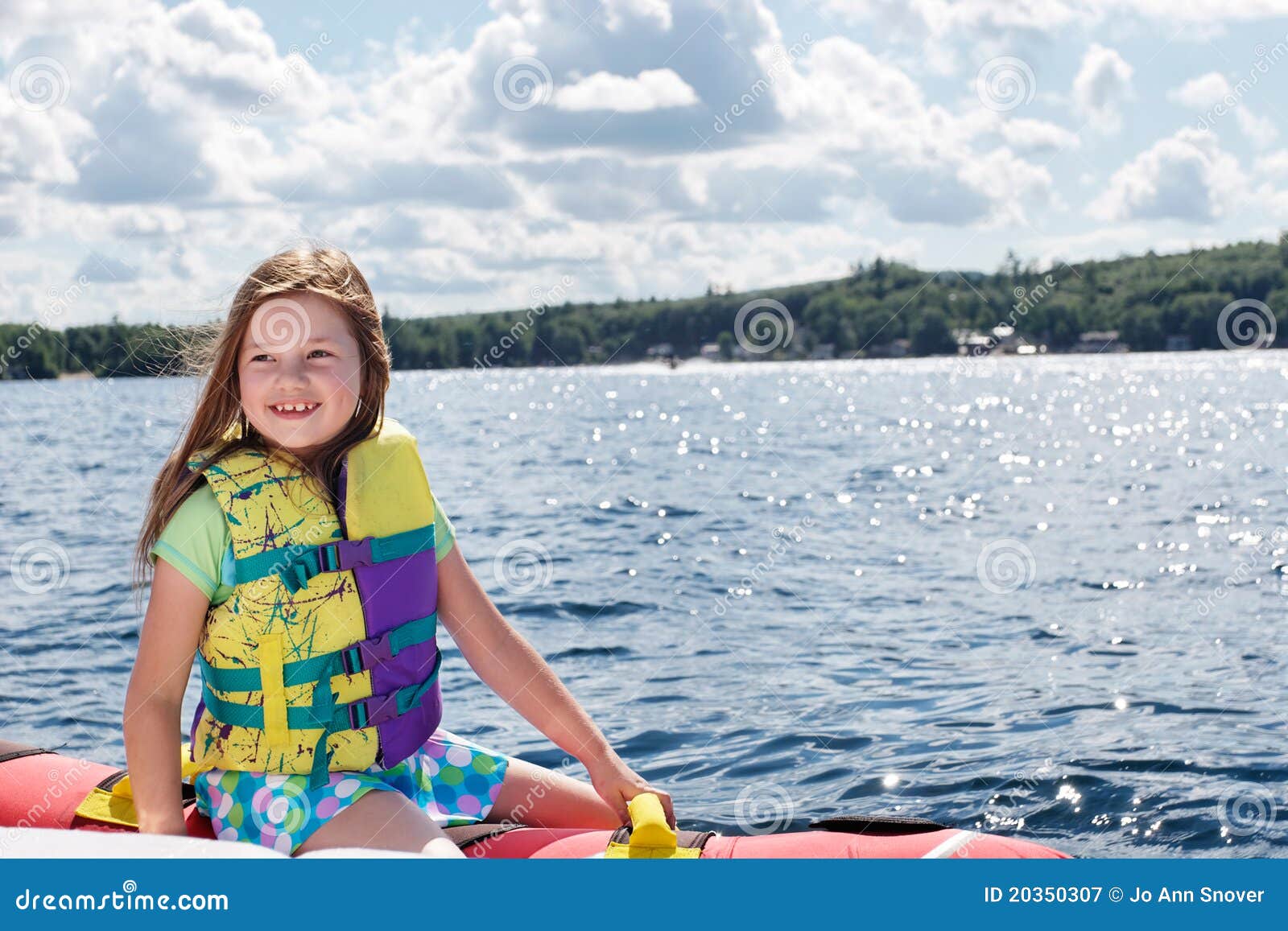Young Girl on Inflatable, Ready To Go Stock Image - Image of lake ...