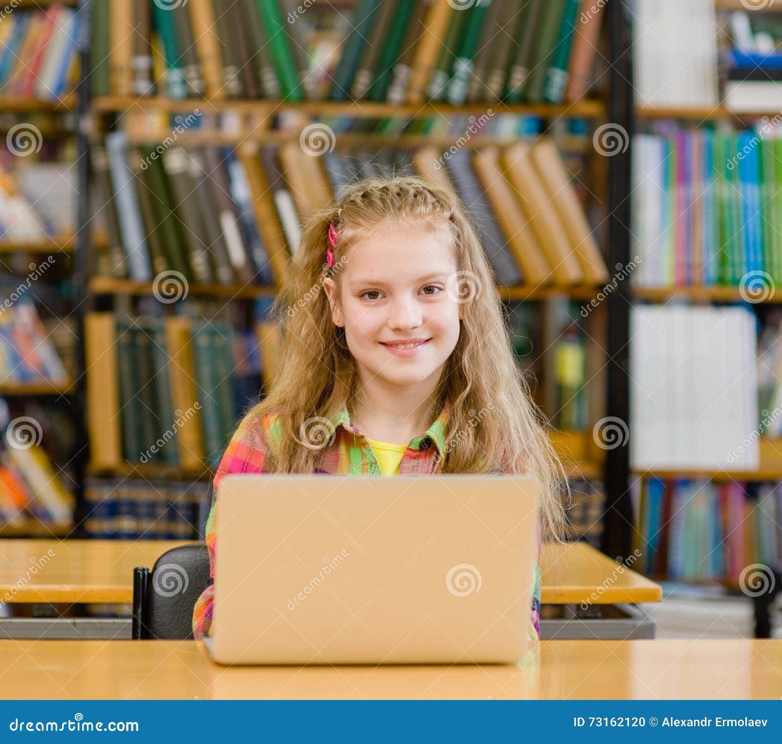 Young Girl with Laptop in Library Stock Photo - Image of elementary ...