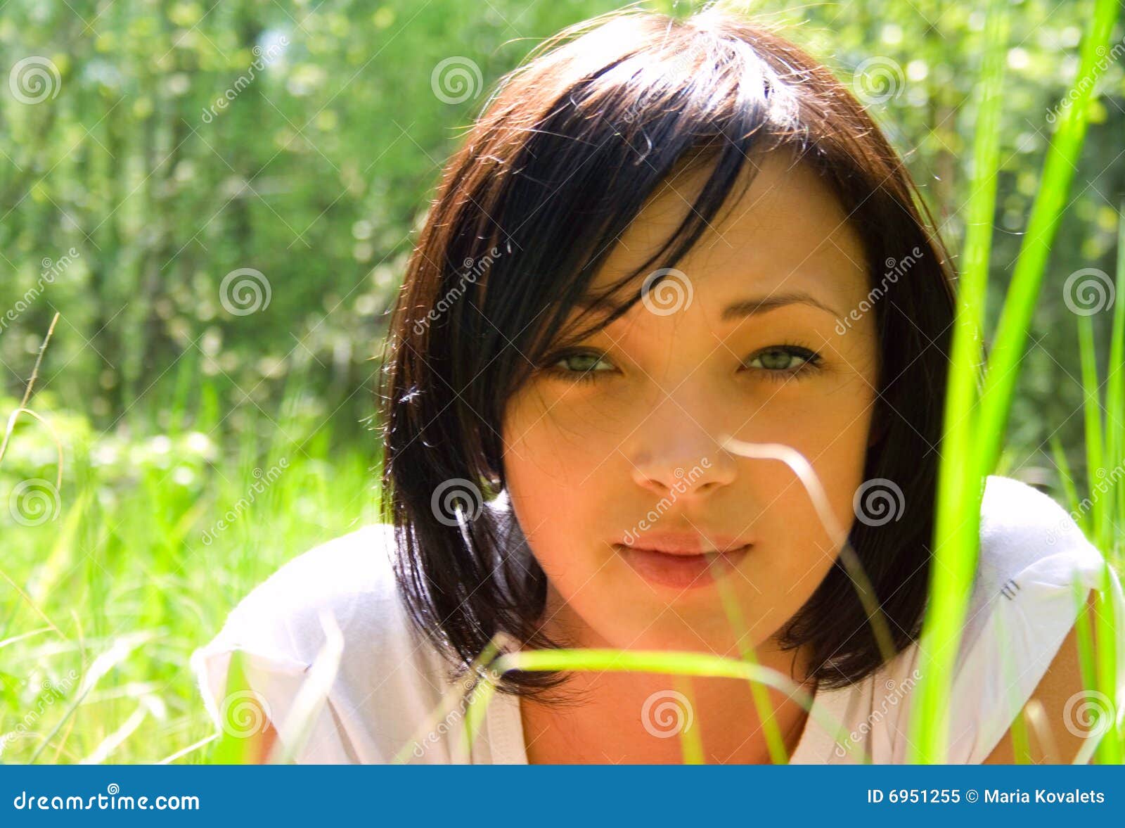 Young Girl Laying on a Field among Green Grass Stock Image - Image of ...
