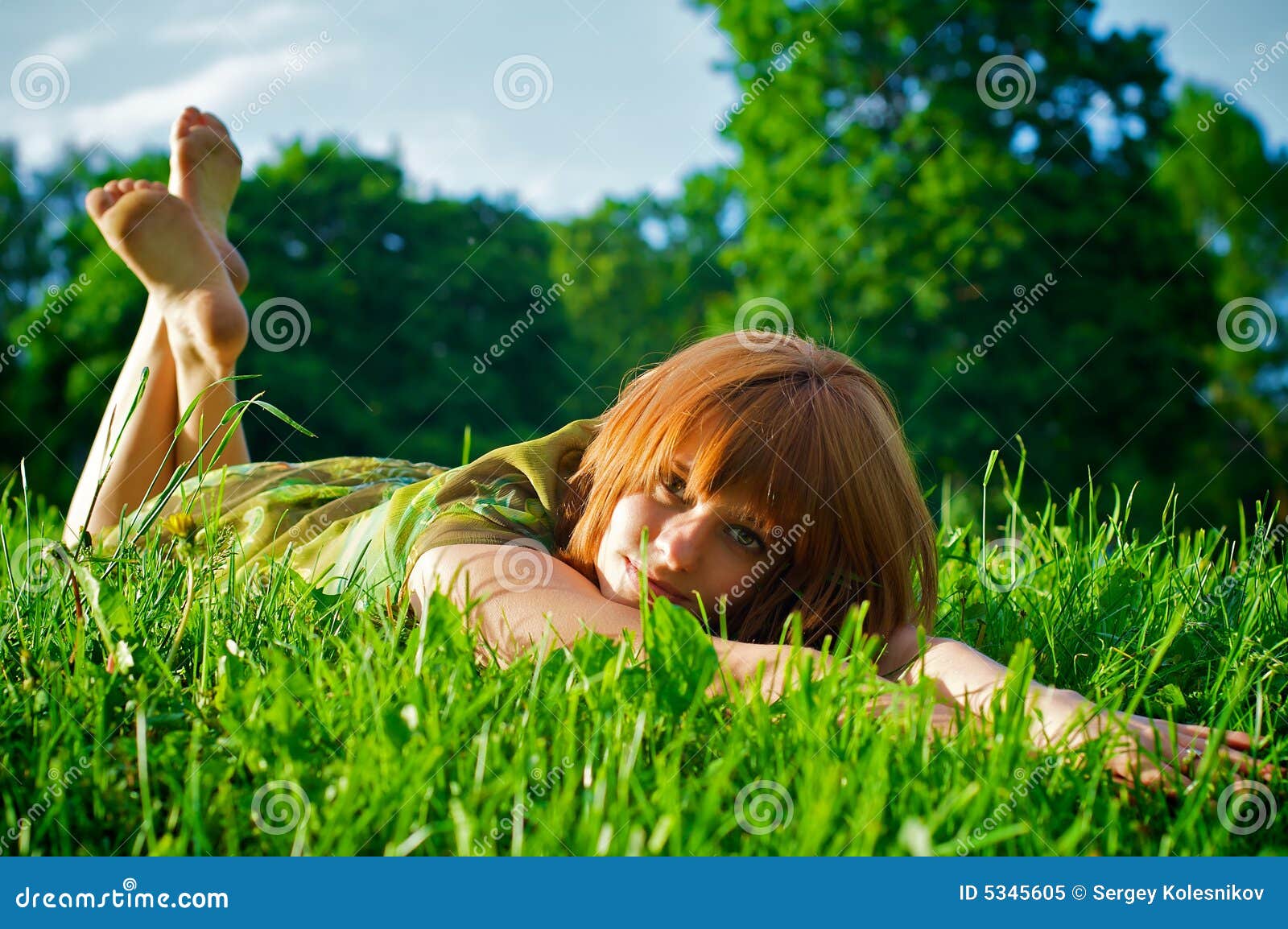 Young girl laying in grass stock image. Image of leisure - 5345605