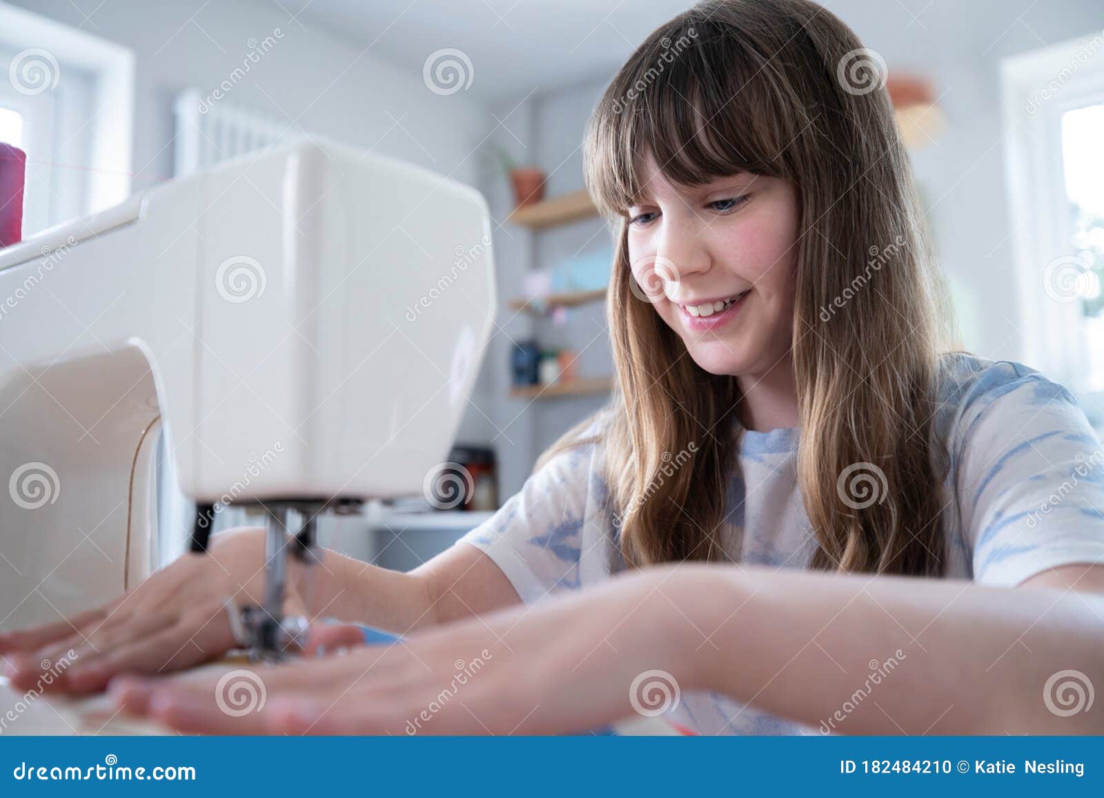 Young Girl Learning How To Use Sewing Machine at Home Stock Photo ...