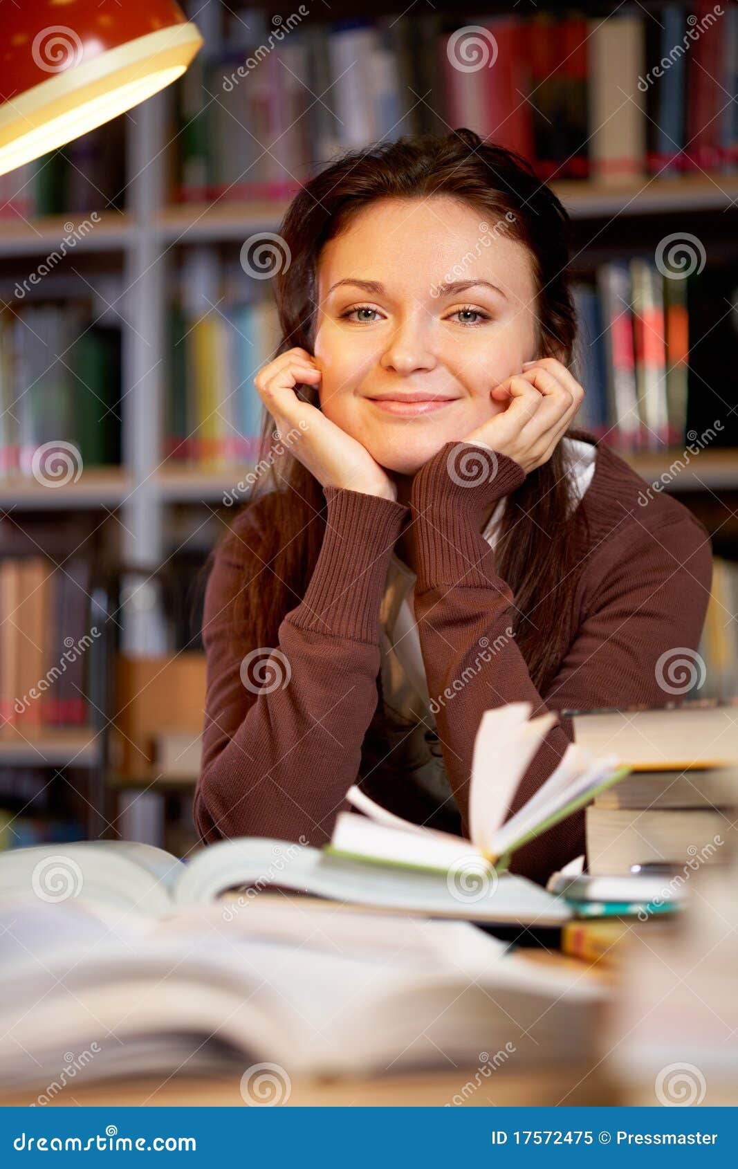 Young girl in library stock image. Image of adult, bookshelf - 17572475