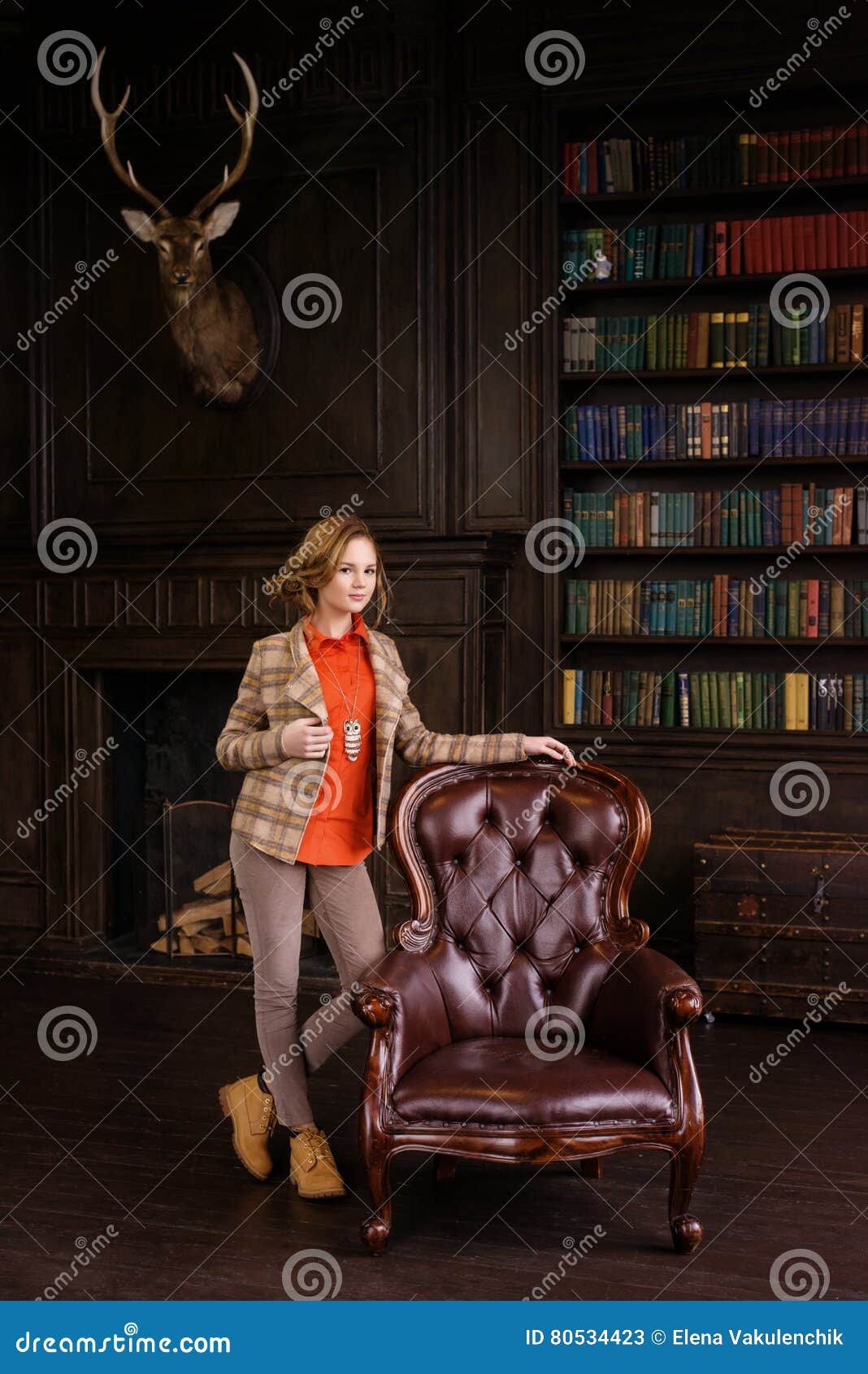 Young girl in the library stock image. Image of paper - 80534423
