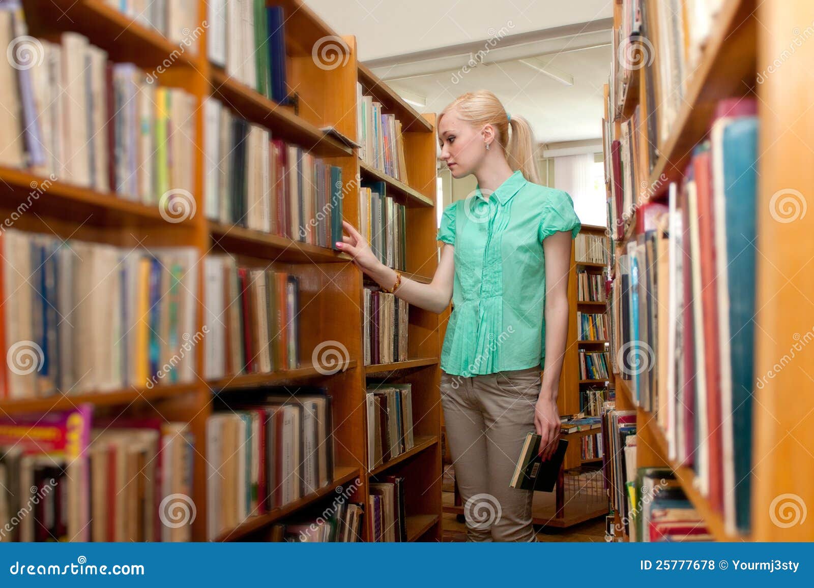 Young Girl in the Library Looking for a Book Stock Photo - Image of ...