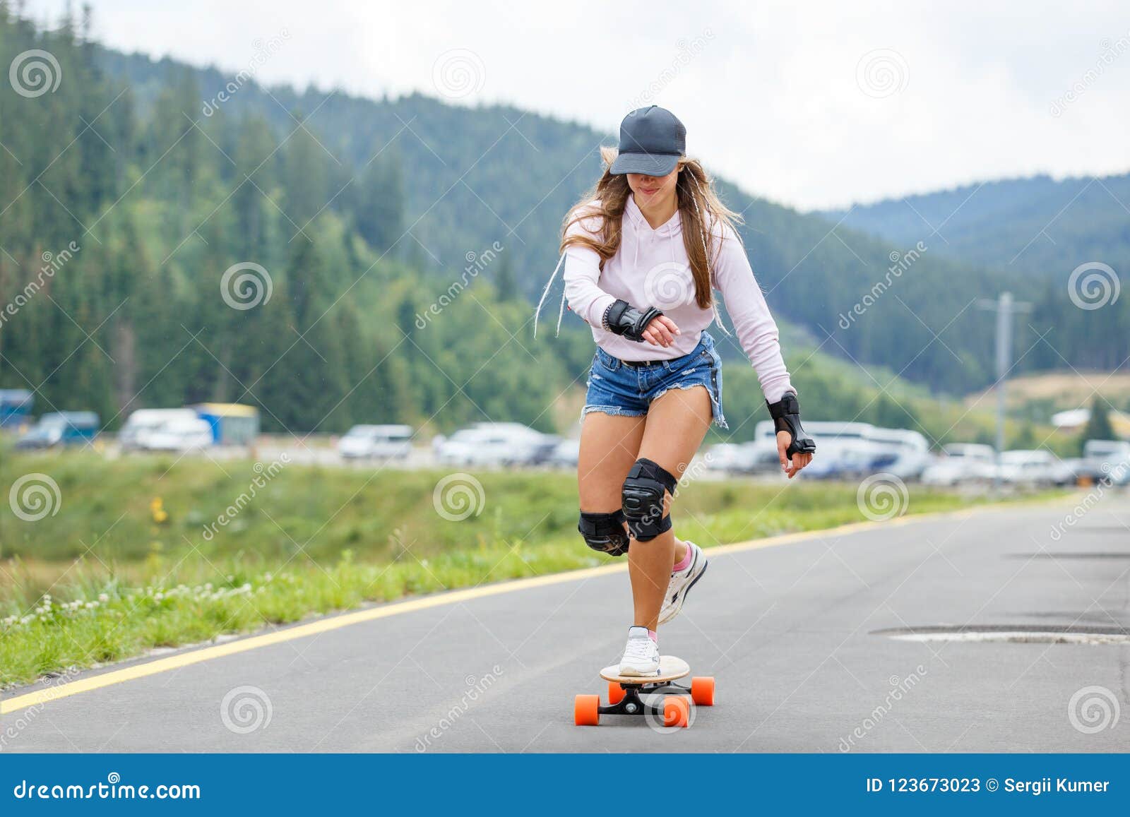 Young Girl Longboarding Downhill on Hillside Road Stock Image - Image ...