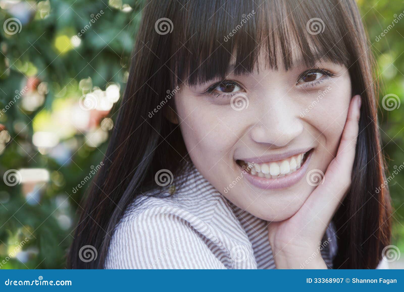 Young Girl Looking at the Camera Stock Image - Image of hand, camera ...