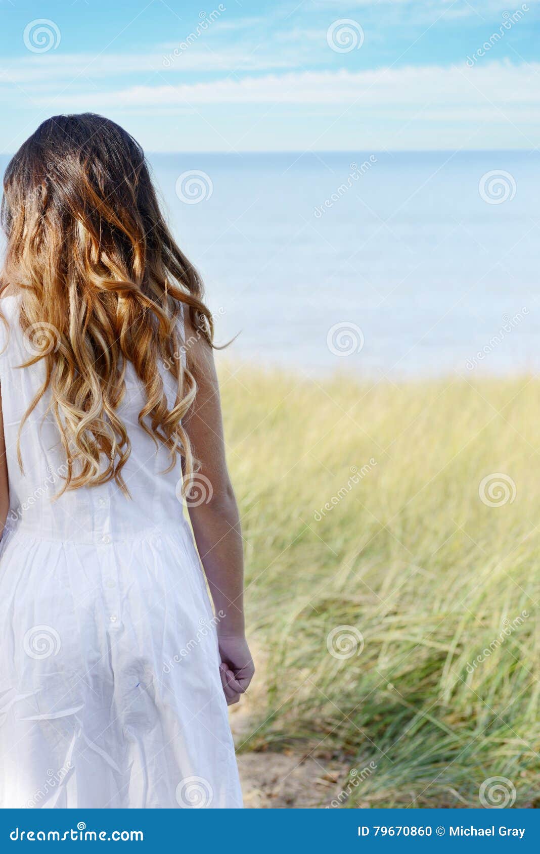 Young Girl Looking at Ocean Stock Photo - Image of sand, clouds: 79670860