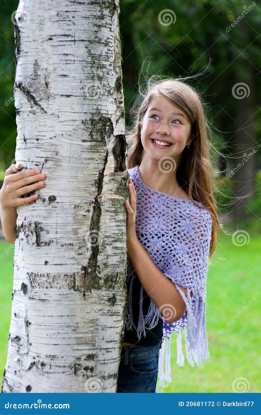 Young Girl Looks Out from the Tree Stock Photo - Image of alone, blond ...