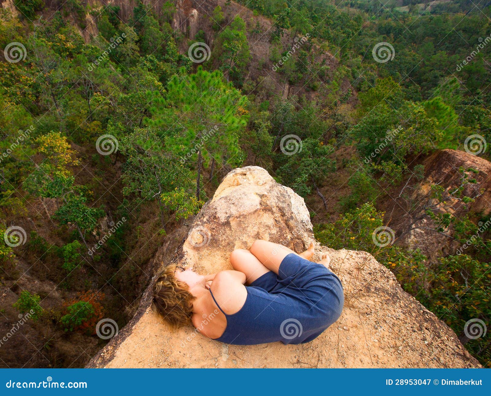 Young Girl Lying on Top of the Rock in the Canyon Stock Image - Image ...