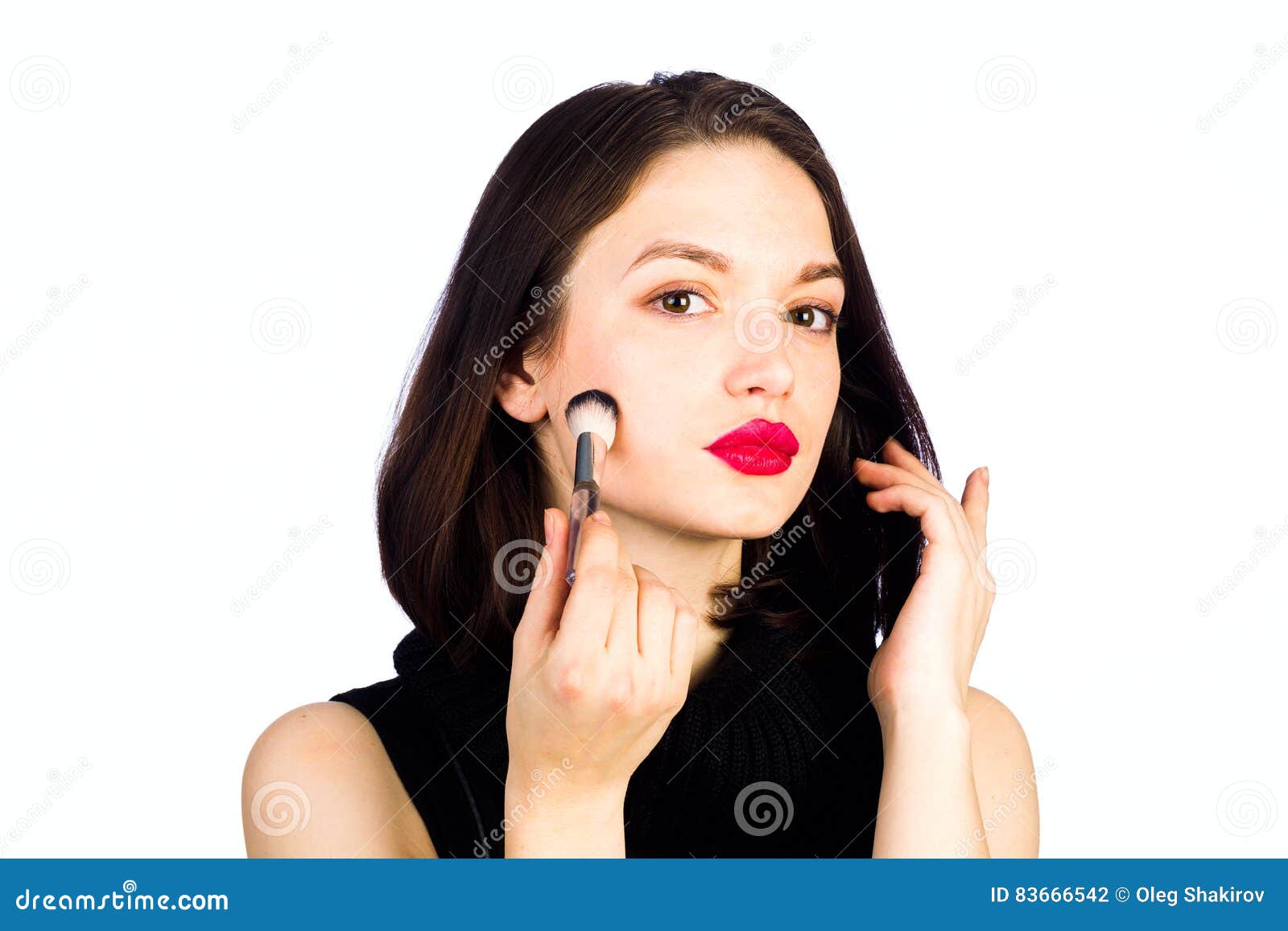 Young girl makes a make-up stock photo. Image of person - 83666542