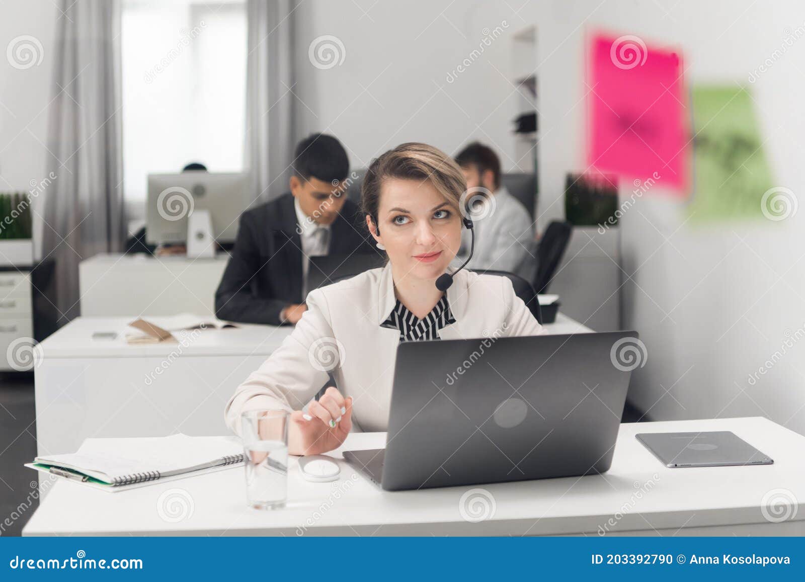 A Young Girl Manager in the Office in a Working Dress Code with a ...