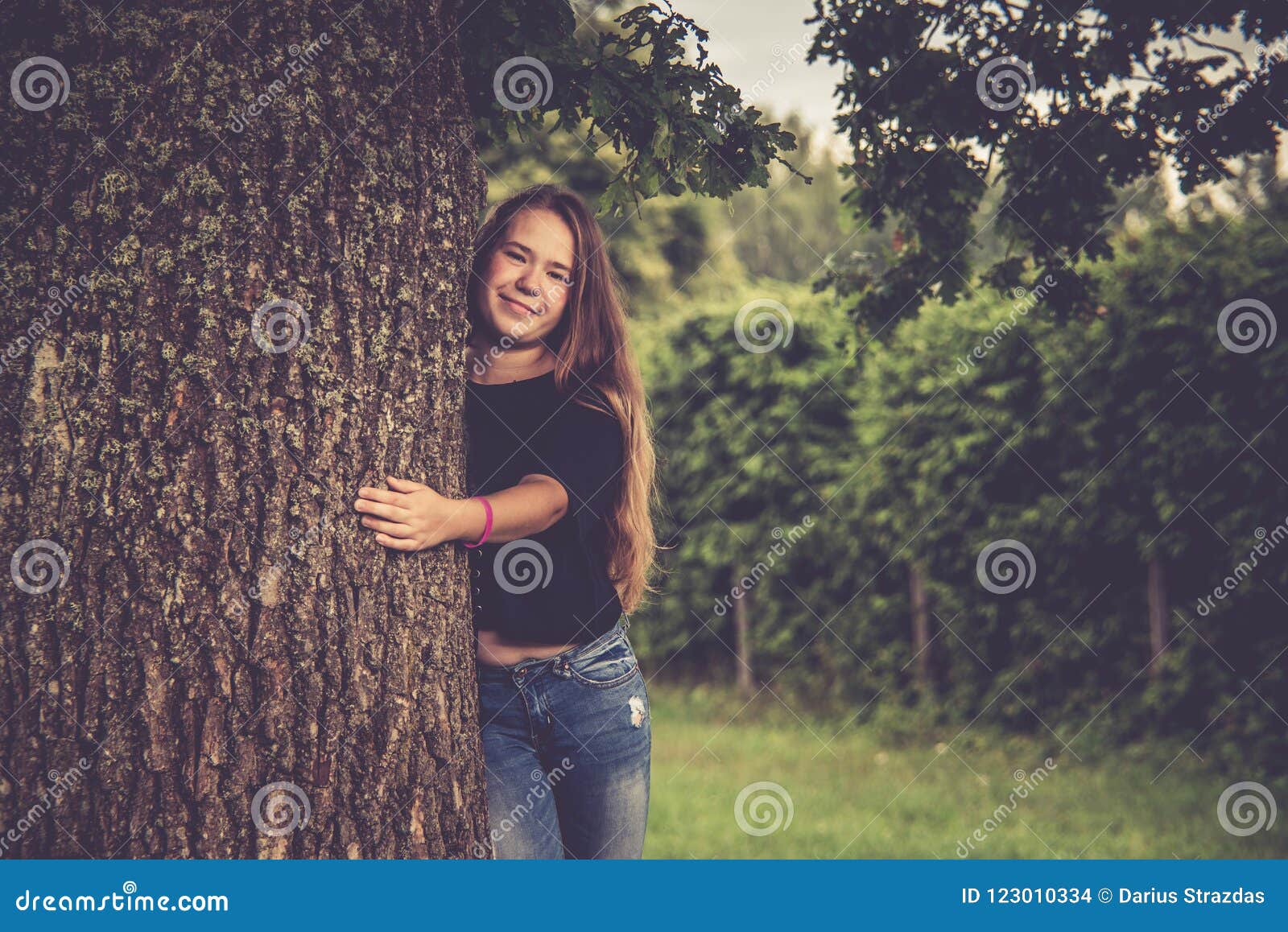 Young Girl Near Tree Posing Stock Photo - Image of outdoors, hugging ...