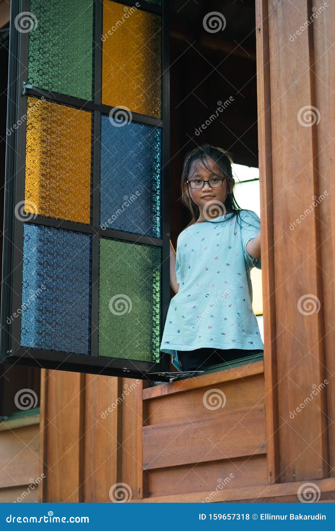 Young Girl Next To the Multicoloured Stained Glass Window. Stock Photo ...