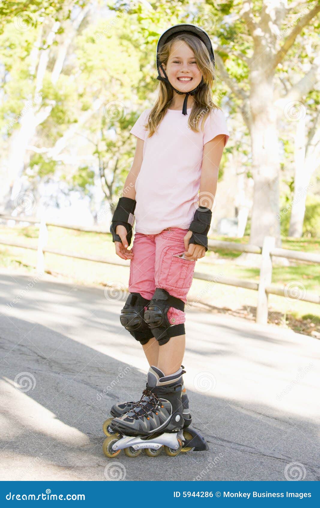 Young Girl Outdoors on Inline Skates Smiling Stock Photo - Image of ...
