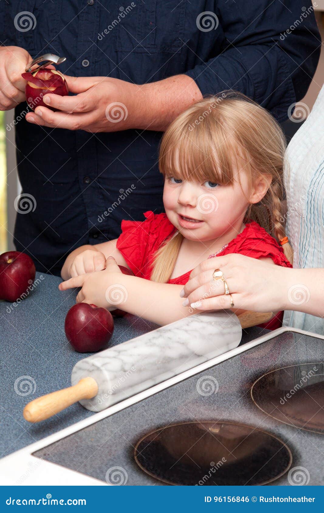 Young Girl Peeling Apples in Kitchen Stock Photo - Image of bakery ...