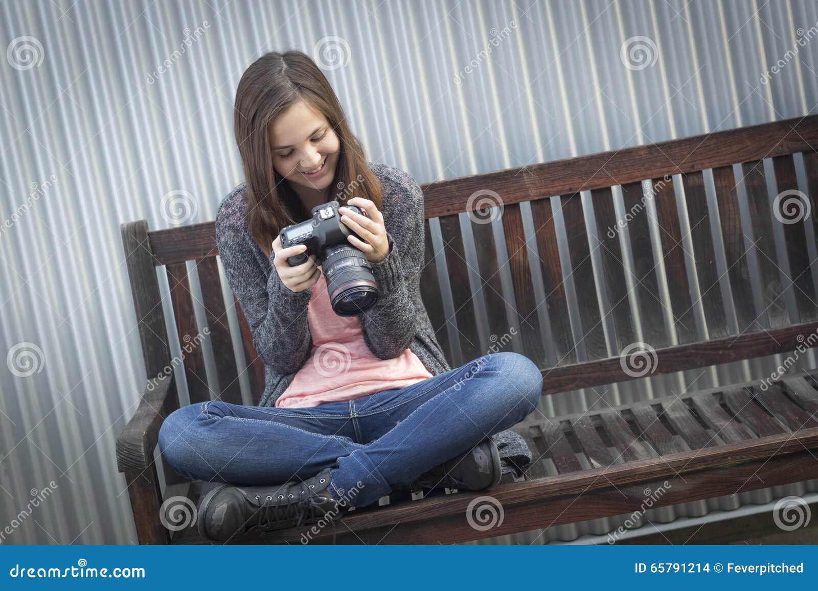 Young Girl Photographer Looking at Back of Camera Stock Photo - Image ...