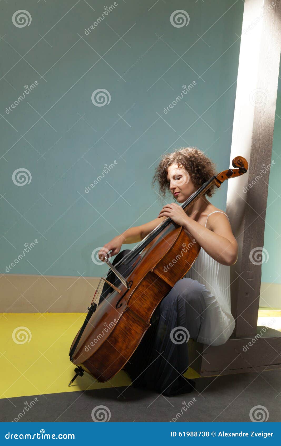 Young girl playing cello stock photo. Image of career - 61988738