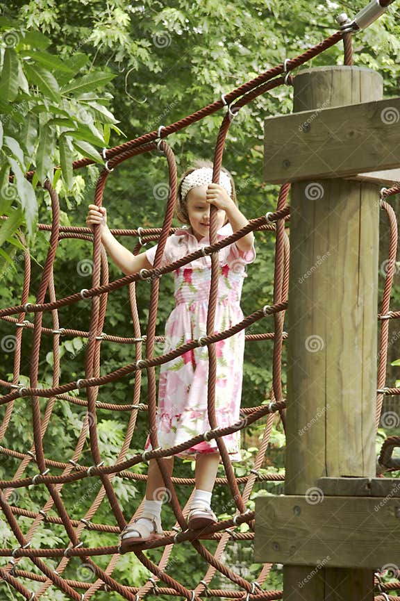 Young Girl Playing on Climbing Frame 01 Stock Image - Image of playing ...