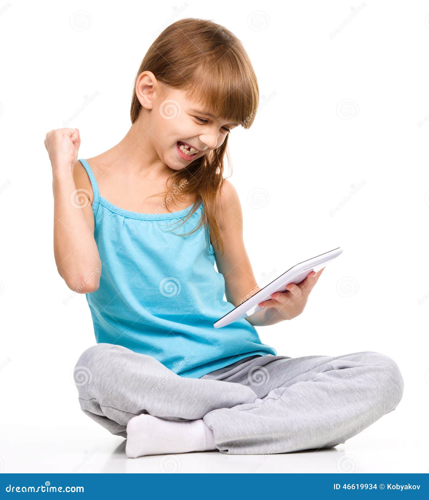 Young Girl is Playing Game Using Tablet Stock Photo - Image of playing ...