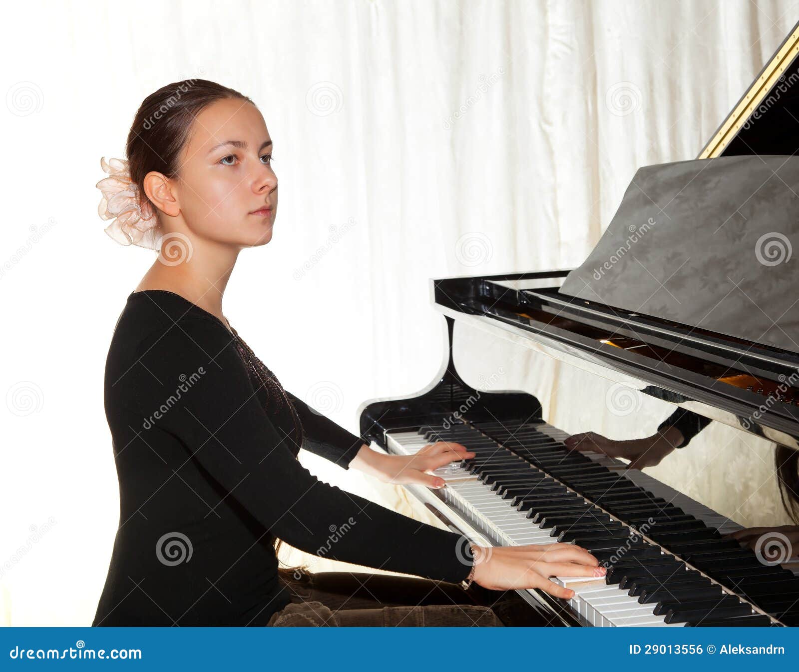 A Young Girl Playing the Piano Stock Photo - Image of pianist, fashion ...