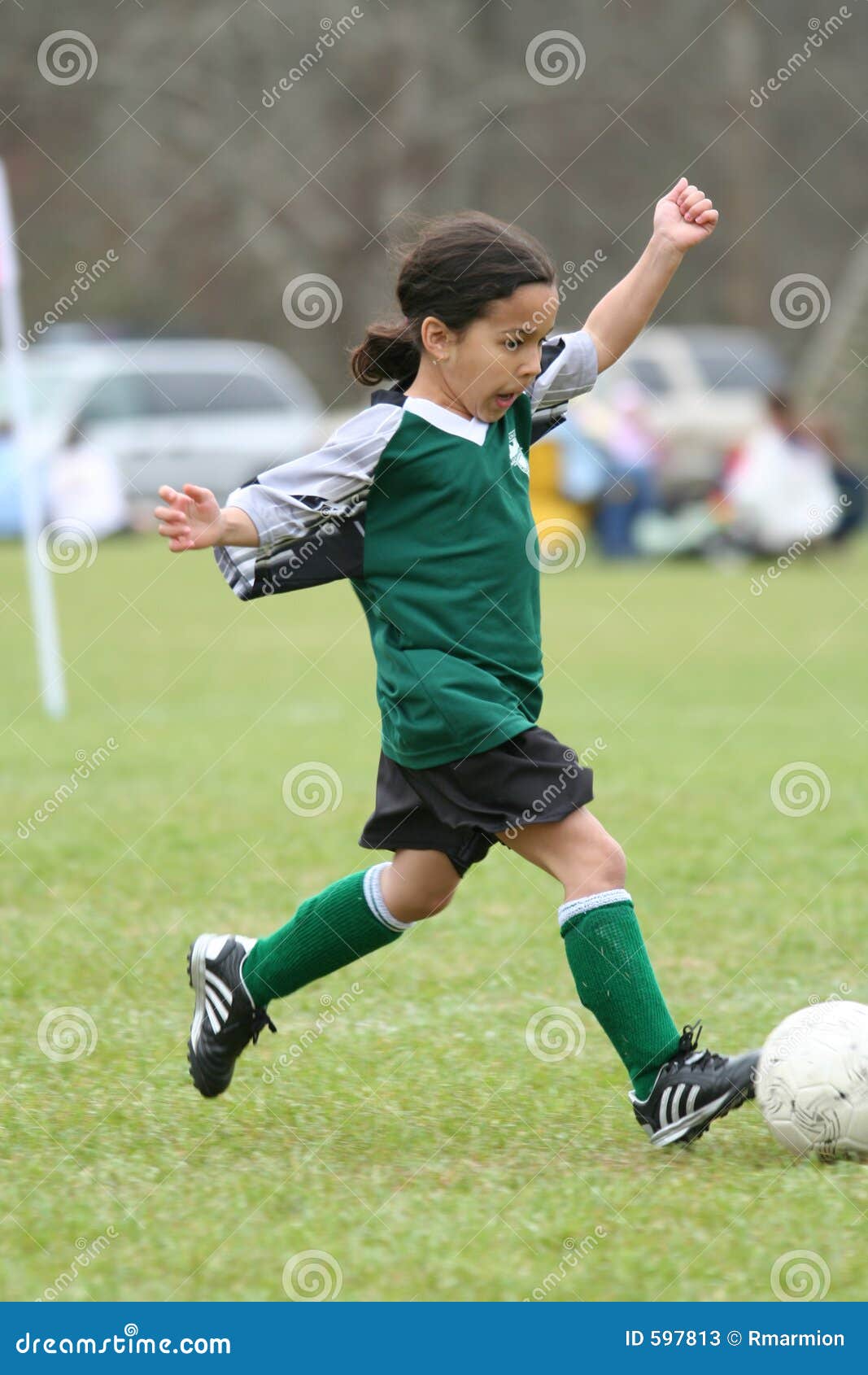 Young Girl Playing Soccer editorial stock photo. Image of kicked - 597813