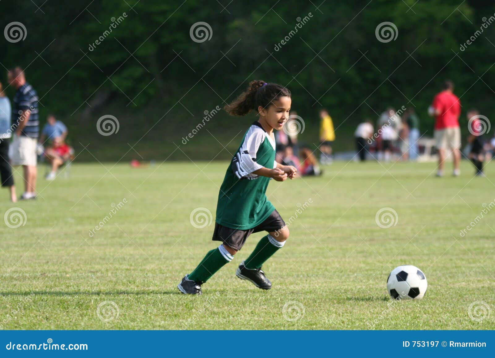Young Girl Playing Soccer stock image. Image of football - 753197