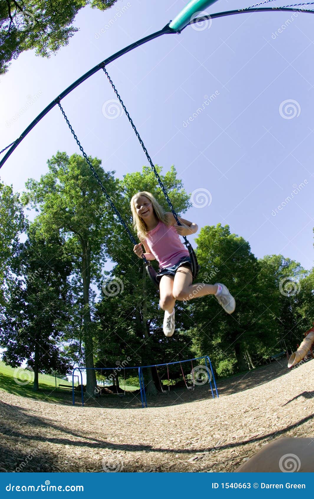 Young Girl Playing on a Swing Set at the Park Stock Image - Image of ...