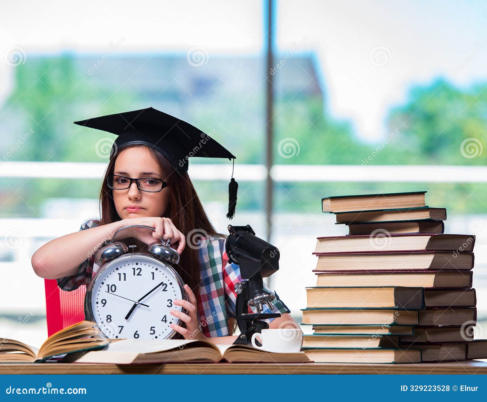 Young Girl Preparing for Exams with Large Clock Stock Photo - Image of ...