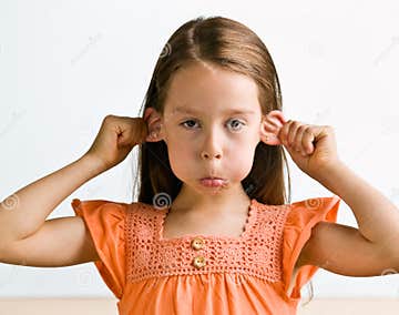 Young girl pulling ears stock photo. Image of child, portrait - 7667704