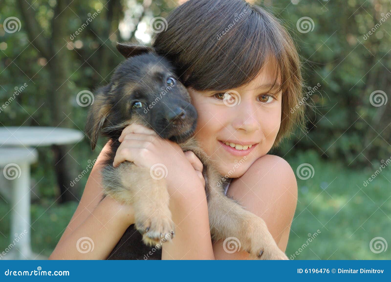 Young girl with puppy stock photo. Image of closeness - 6196476