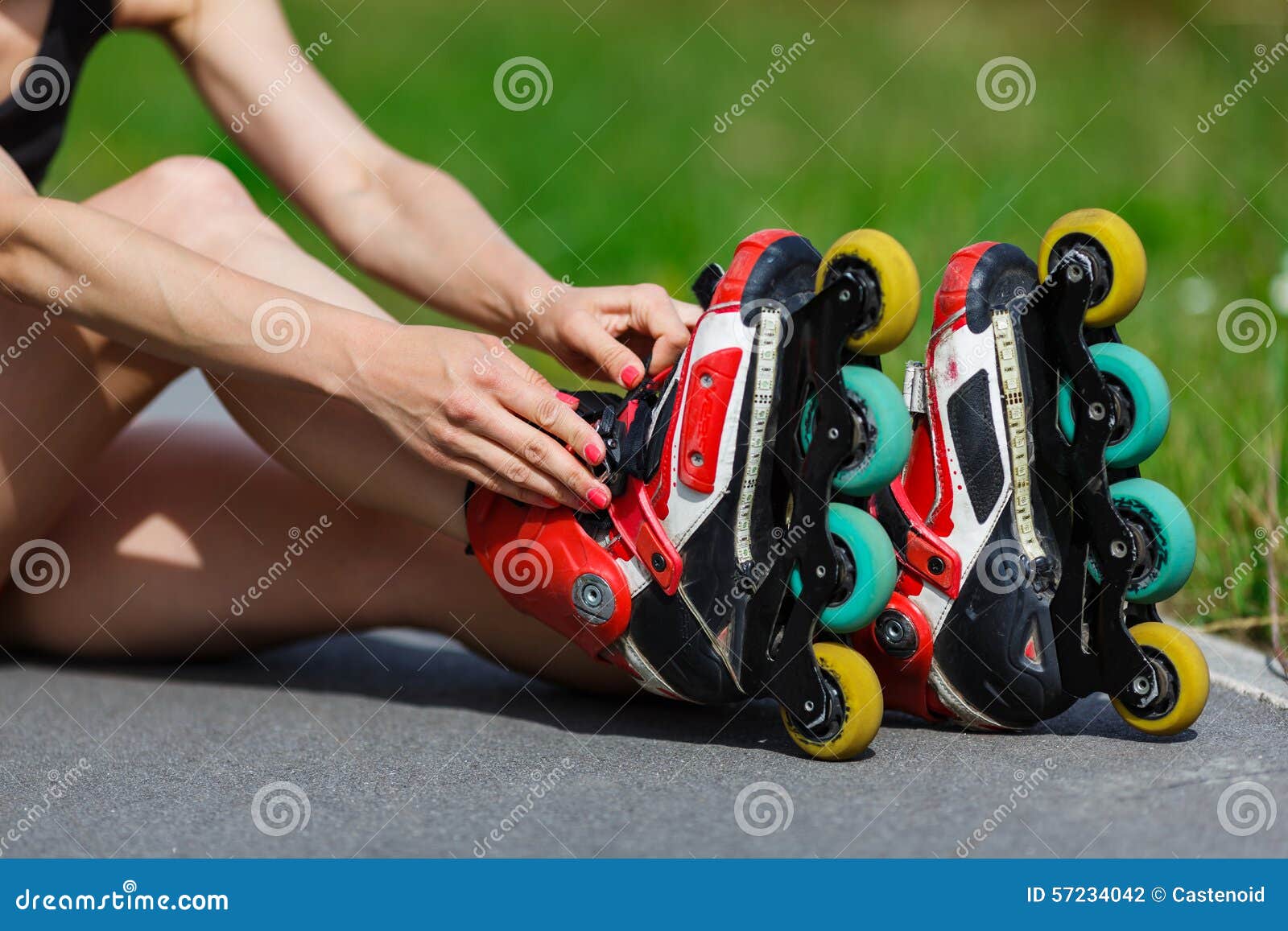Young Girl Putting on Inline Skates Stock Photo - Image of female ...