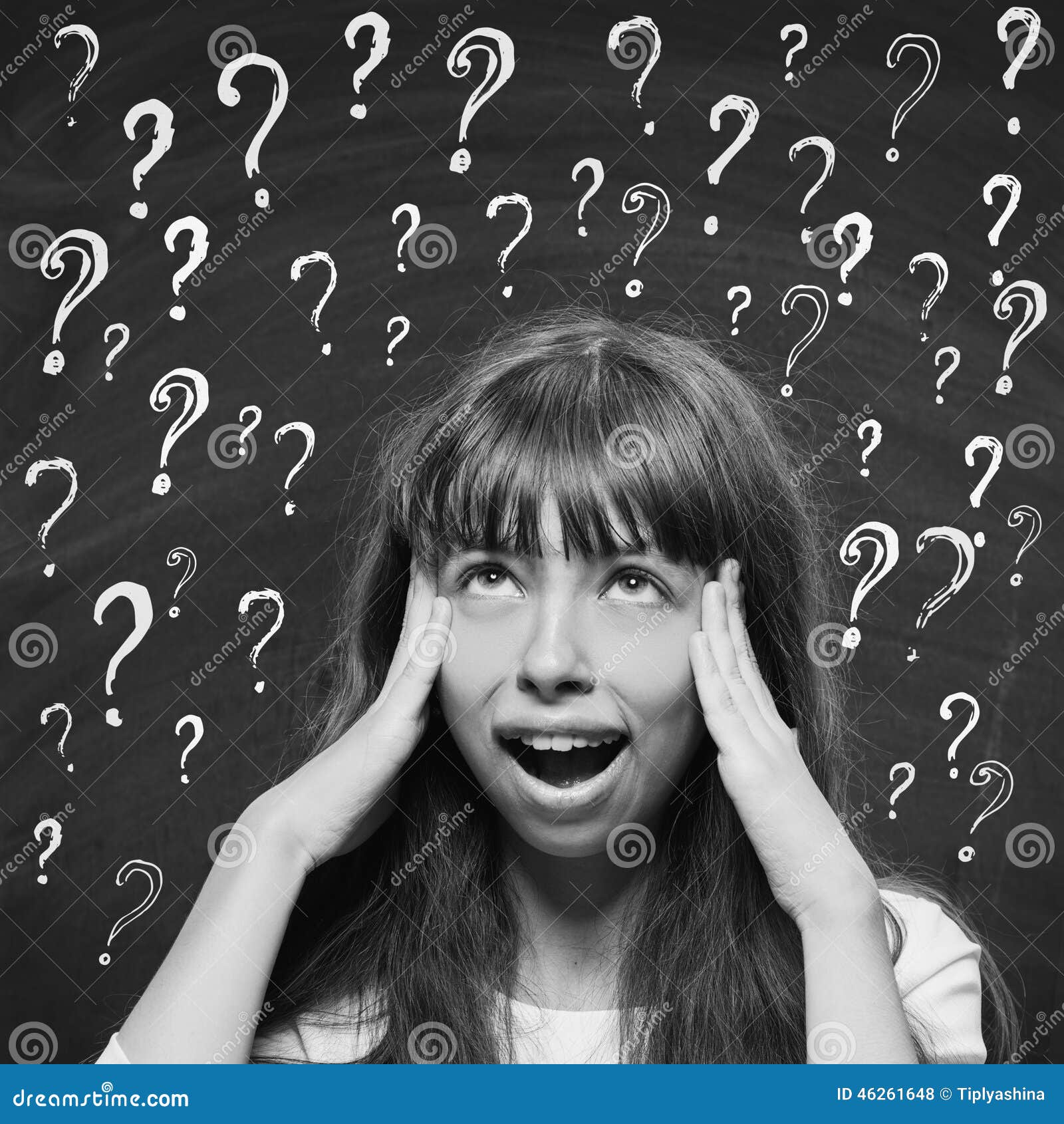 Young Girl with Questioning Expression and Question Marks Above Stock ...