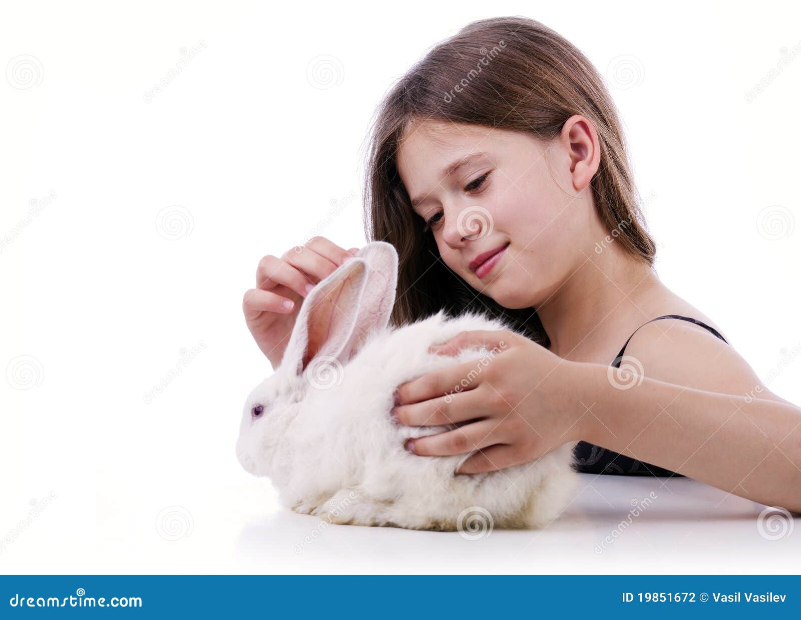 Young girl with rabbit stock photo. Image of looking - 19851672