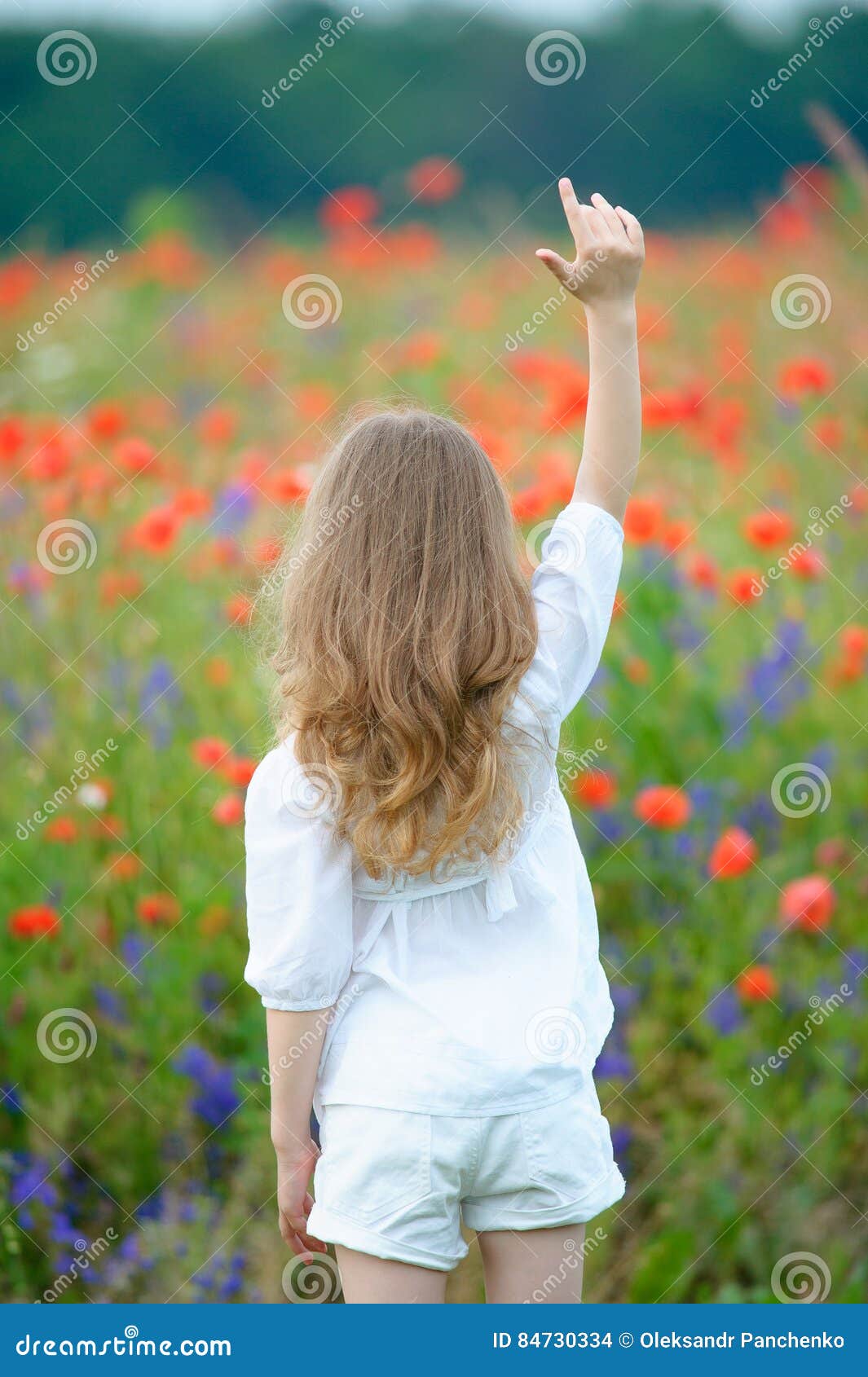 Young Girl with Raised Hands To the Top. View from the Back Stock Photo ...