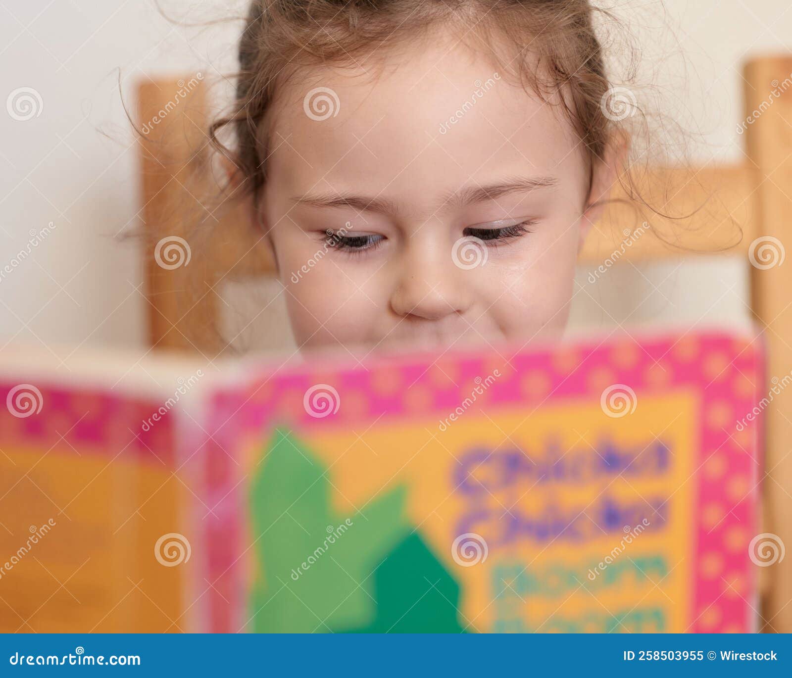 Young Girl Reading a Book Intently Stock Image - Image of tracing ...