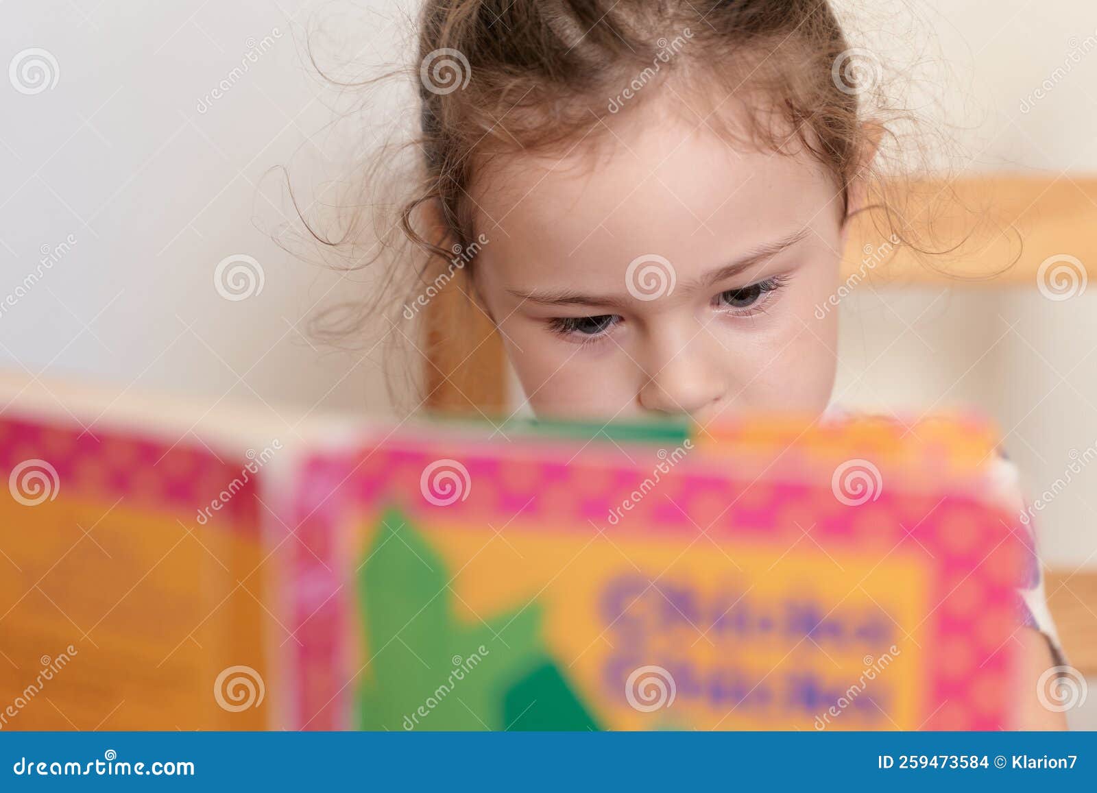 Expressive Young Girl is Doing Her Homework Stock Photo - Image of book ...