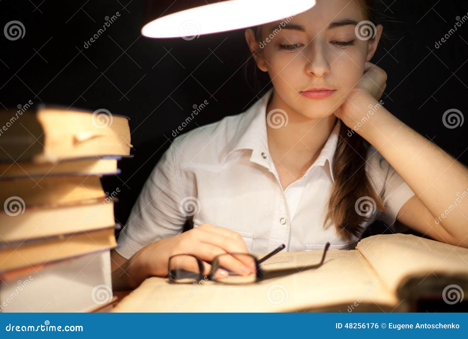 Young Girl Reading Book Under Lamp Stock Photo - Image of night ...
