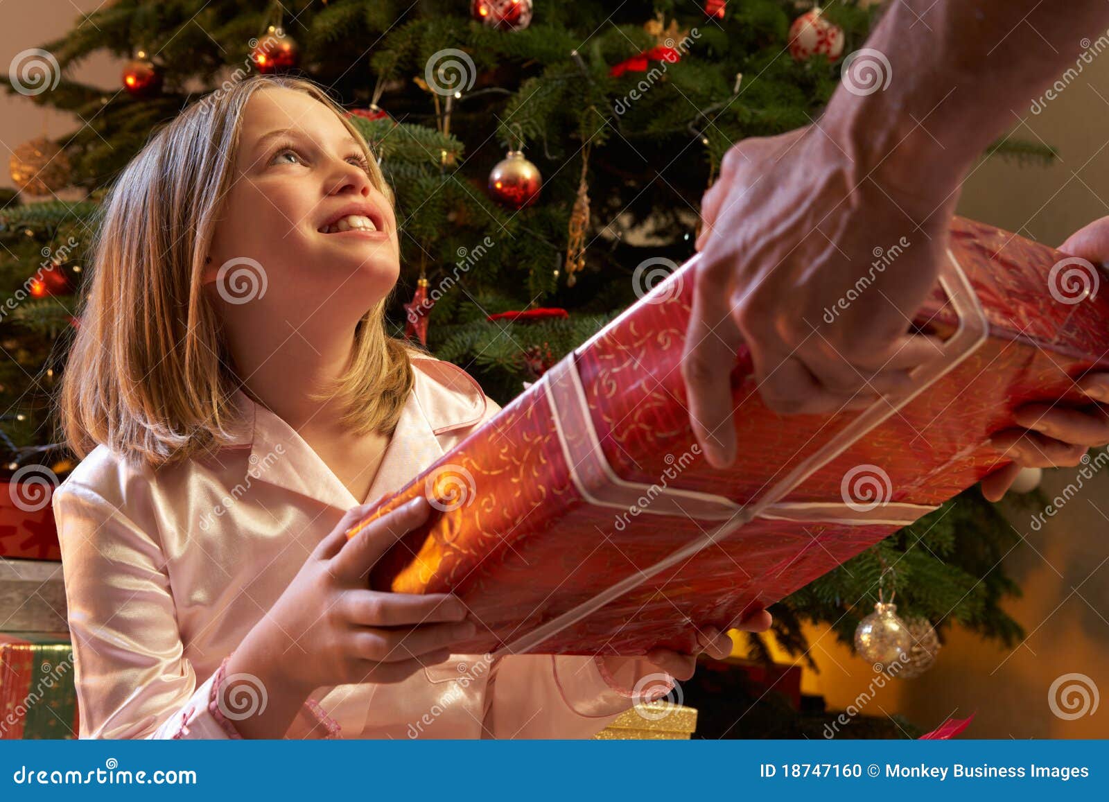 Young Girl Receiving Christmas Present Stock Photo - Image of nine ...
